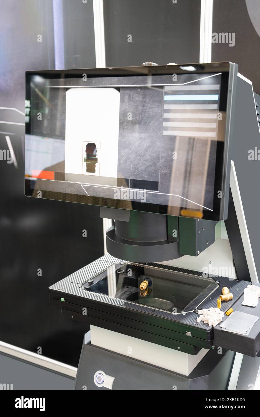 Optic machine for precise measurement of part size and quality ...