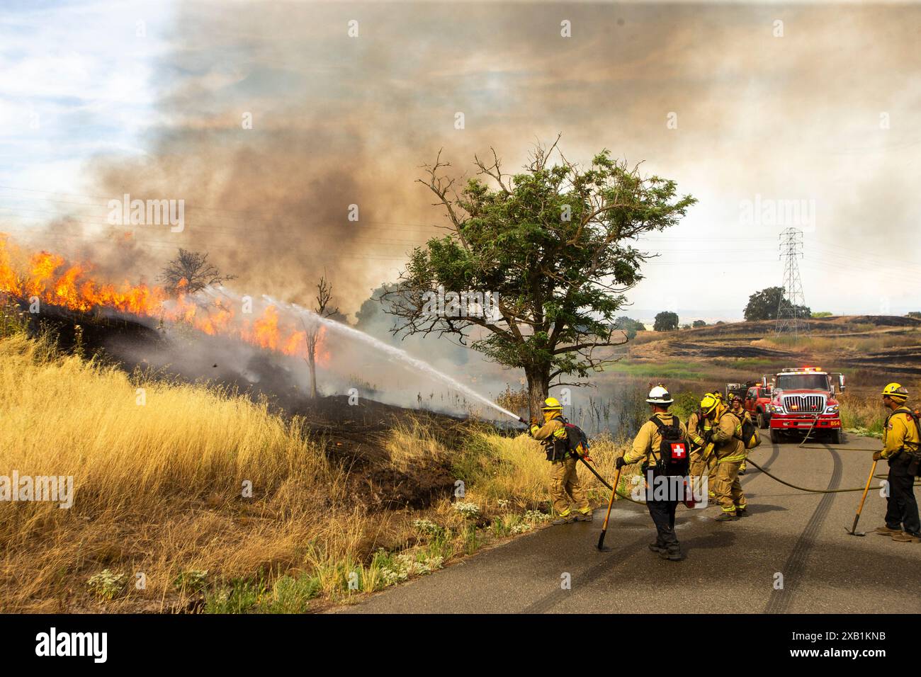 Waterford, Ca, USA. 8th June, 2024. Firefighters work on a progressive ...