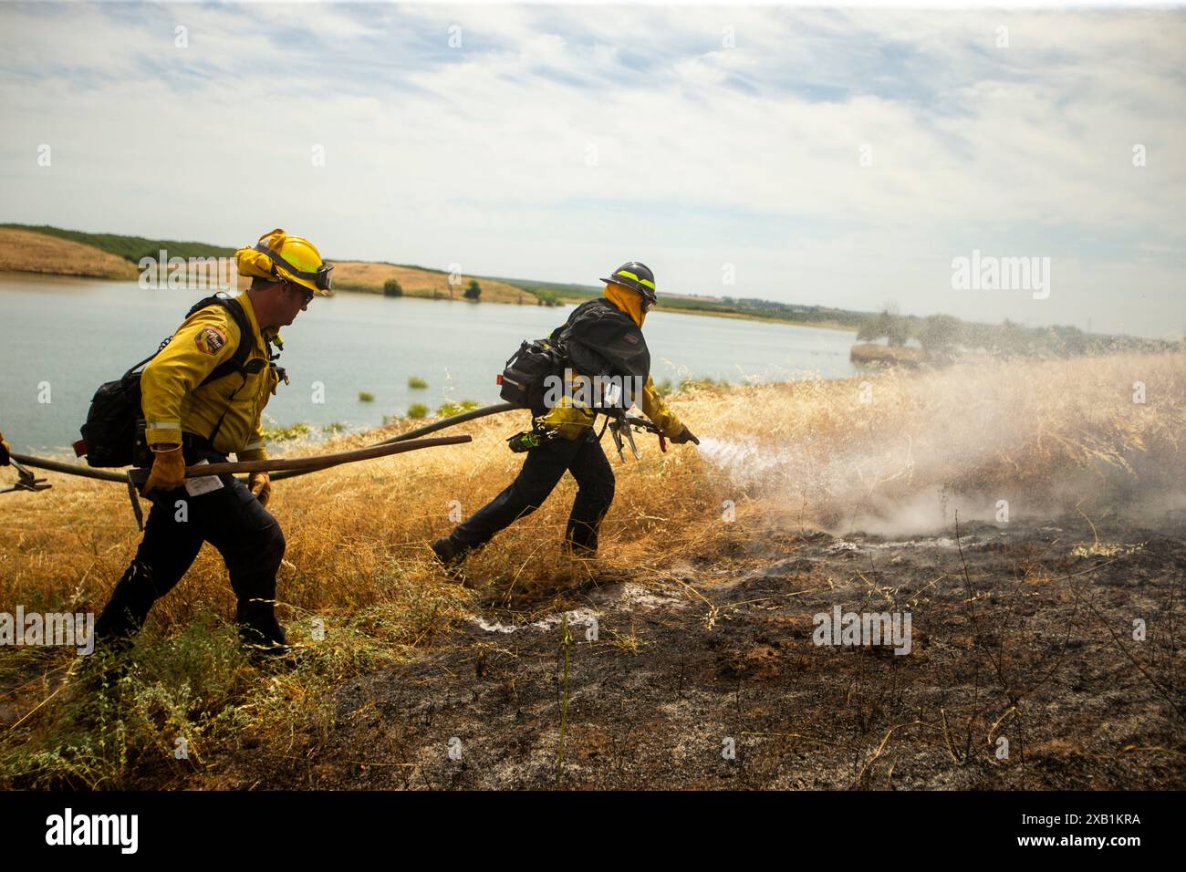 Waterford, Ca, USA. 8th June, 2024. A firefighter works his way up a ...