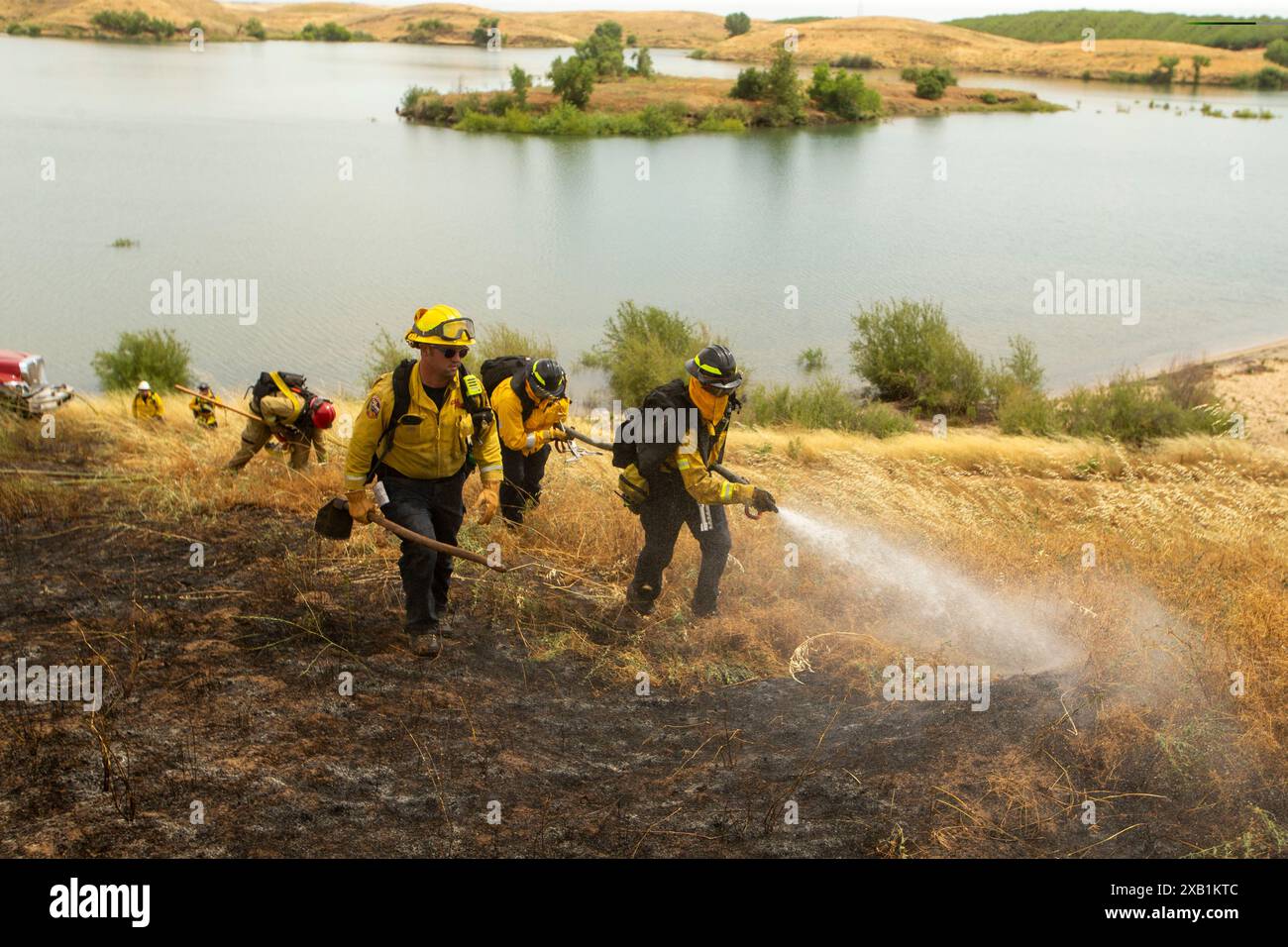 Waterford, Ca, USA. 8th June, 2024. Firefighters work on a progressive ...
