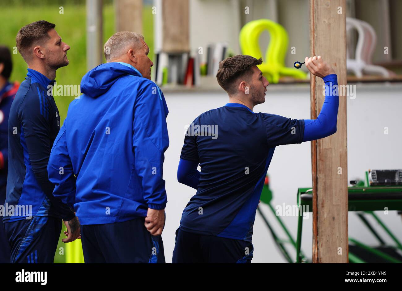Scotland's Liam Cooper (left) and Billy Gilmour (right) play darts ...