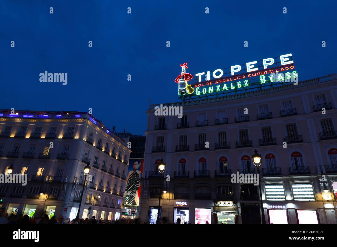 Madrid, Spain- April 8, 2024: Tio Pepe sign at night in Puerta del Sol ...