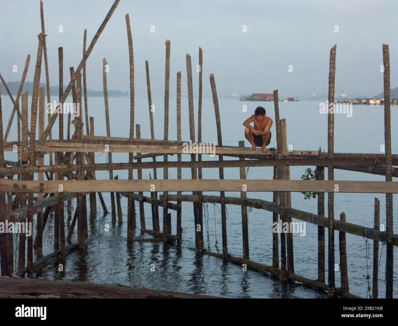 Fishermen working on platforms in Malaysia Stock Photo - Alamy