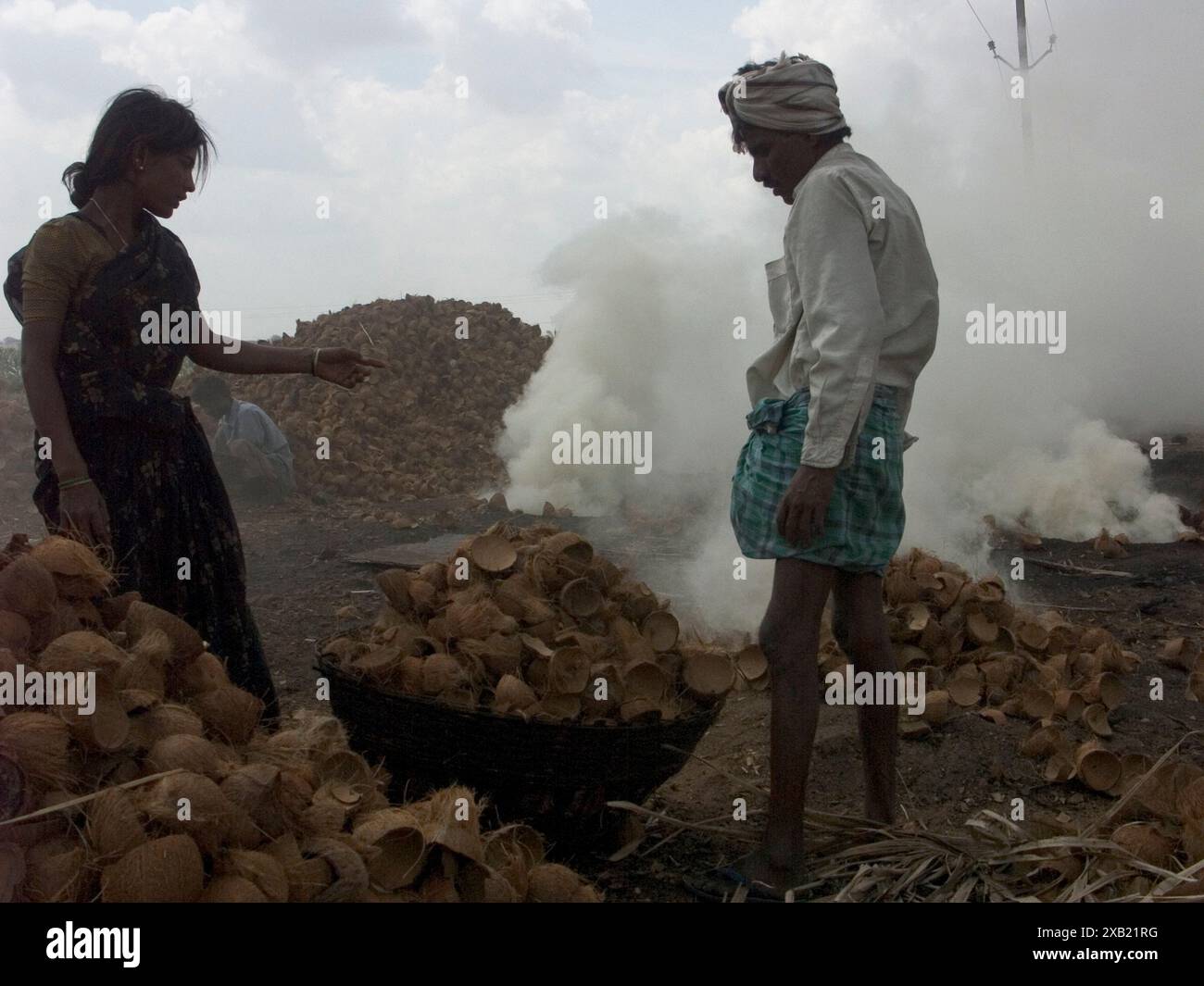 Coconut husk burning Stock Photo - Alamy