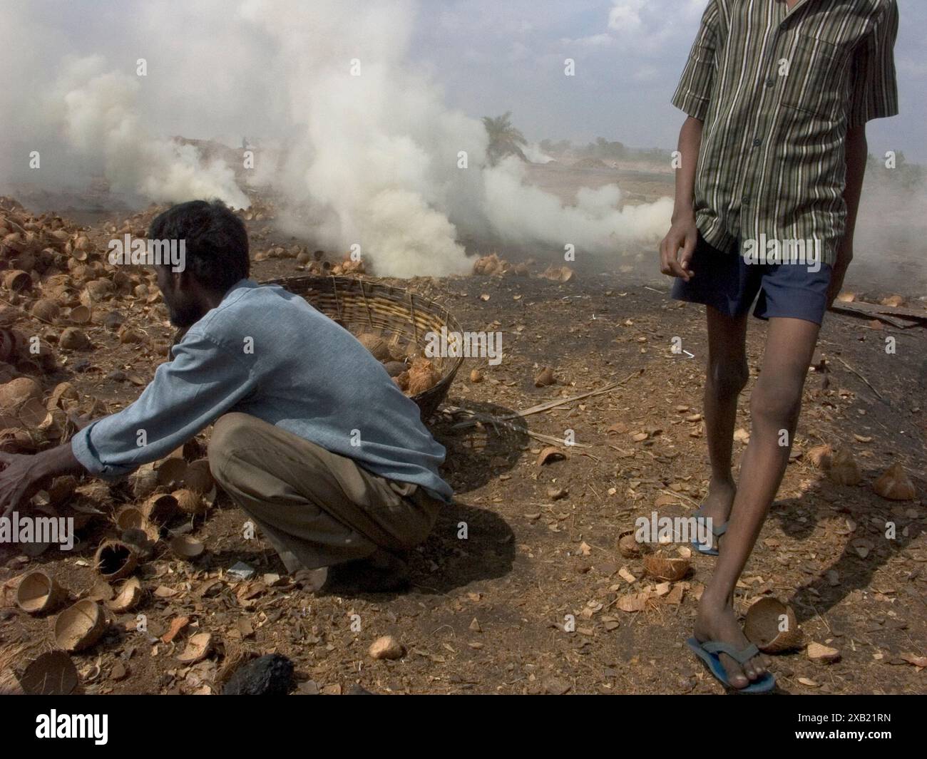 Coconut husk burning Stock Photo - Alamy