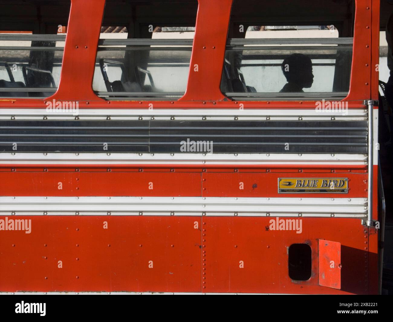 A person rides a Former American school buses, which now serve as ...