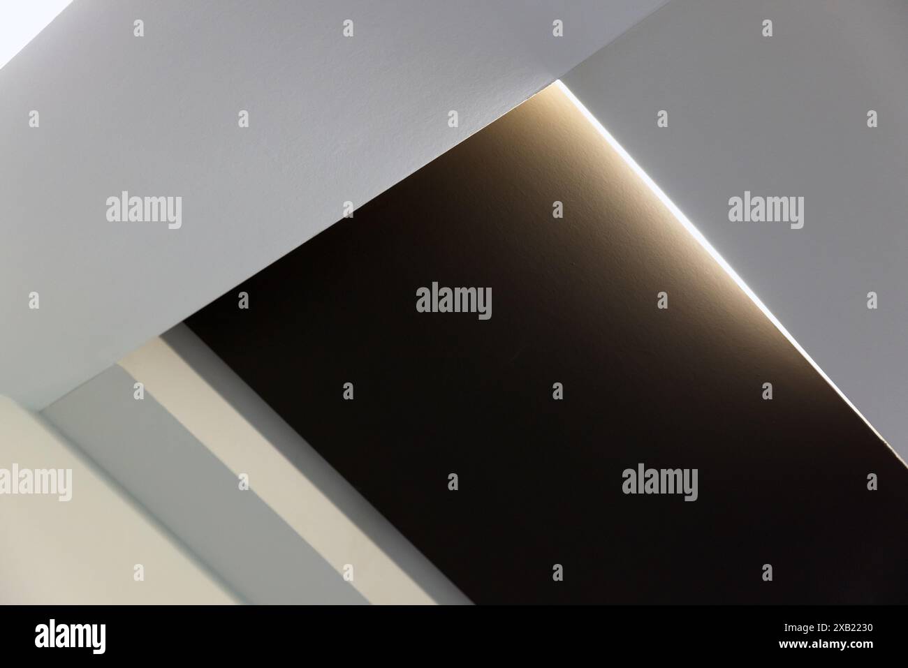 Abstract minimal interior details. Dark ceiling niche with glowing ...