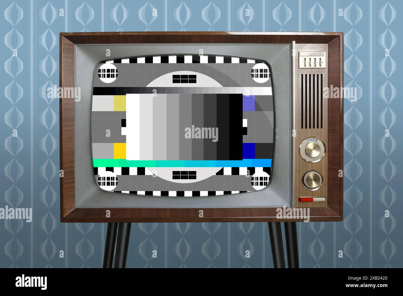 old retro analog TV in room with old fashioned wallpaper, red button ...