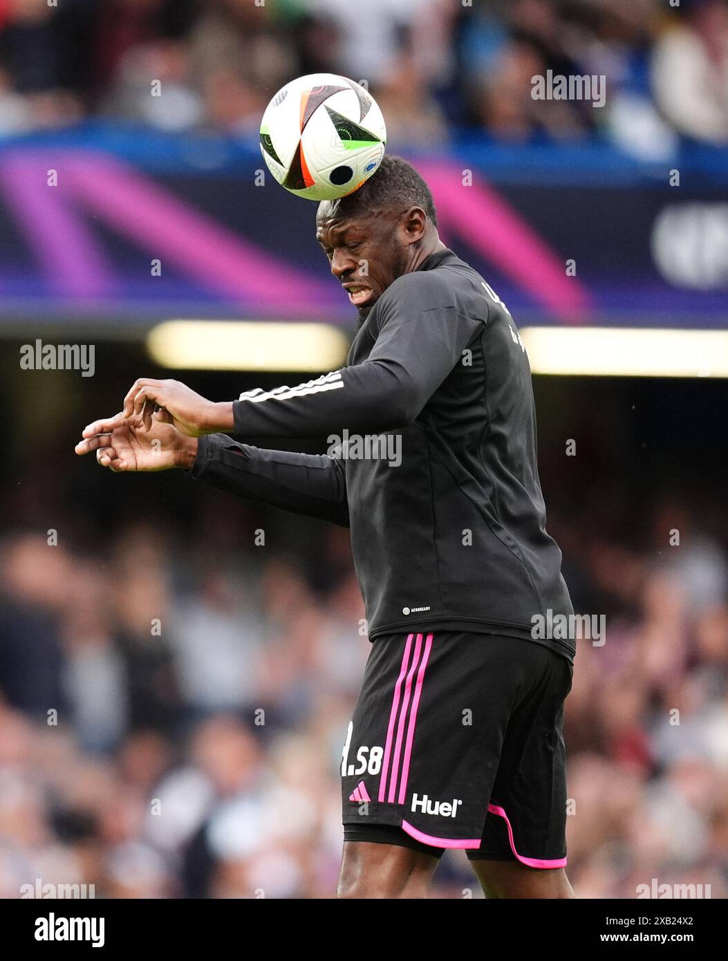 World XI's Usain Bolt warming up prior to kick-off before Soccer Aid ...