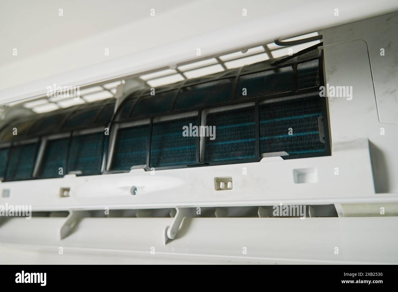 White air conditioner unit is mounted on wall, ready for maintenance ...