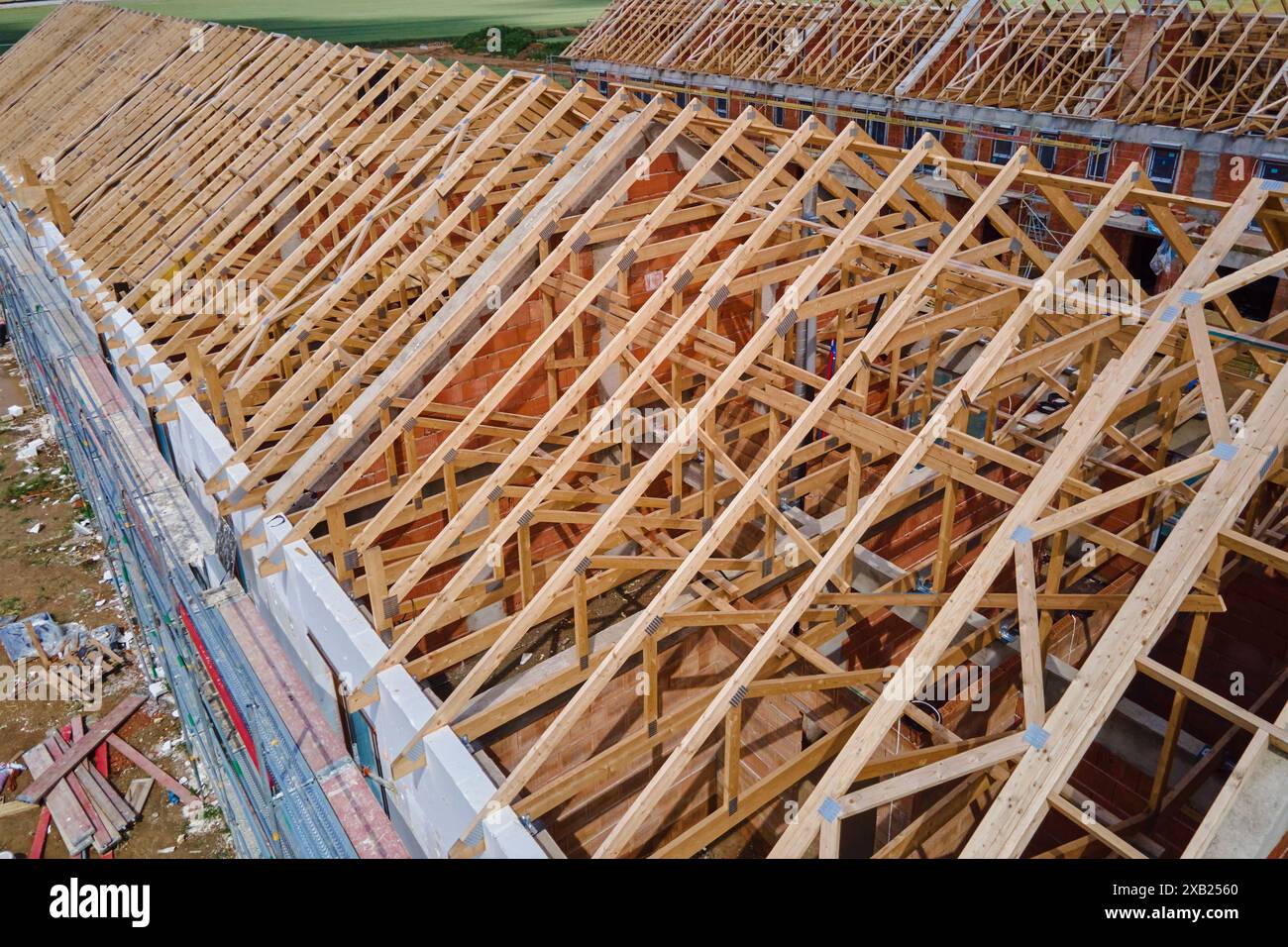 New house under construction, wooden truss system forming roof. Process ...