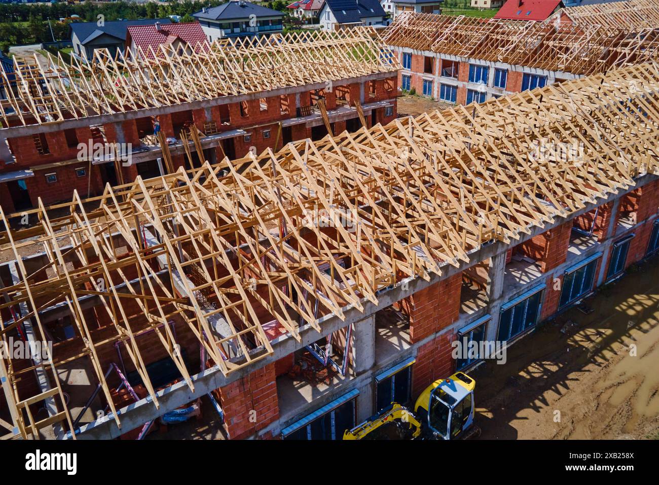 New house under construction, wooden truss system forming roof. Process ...