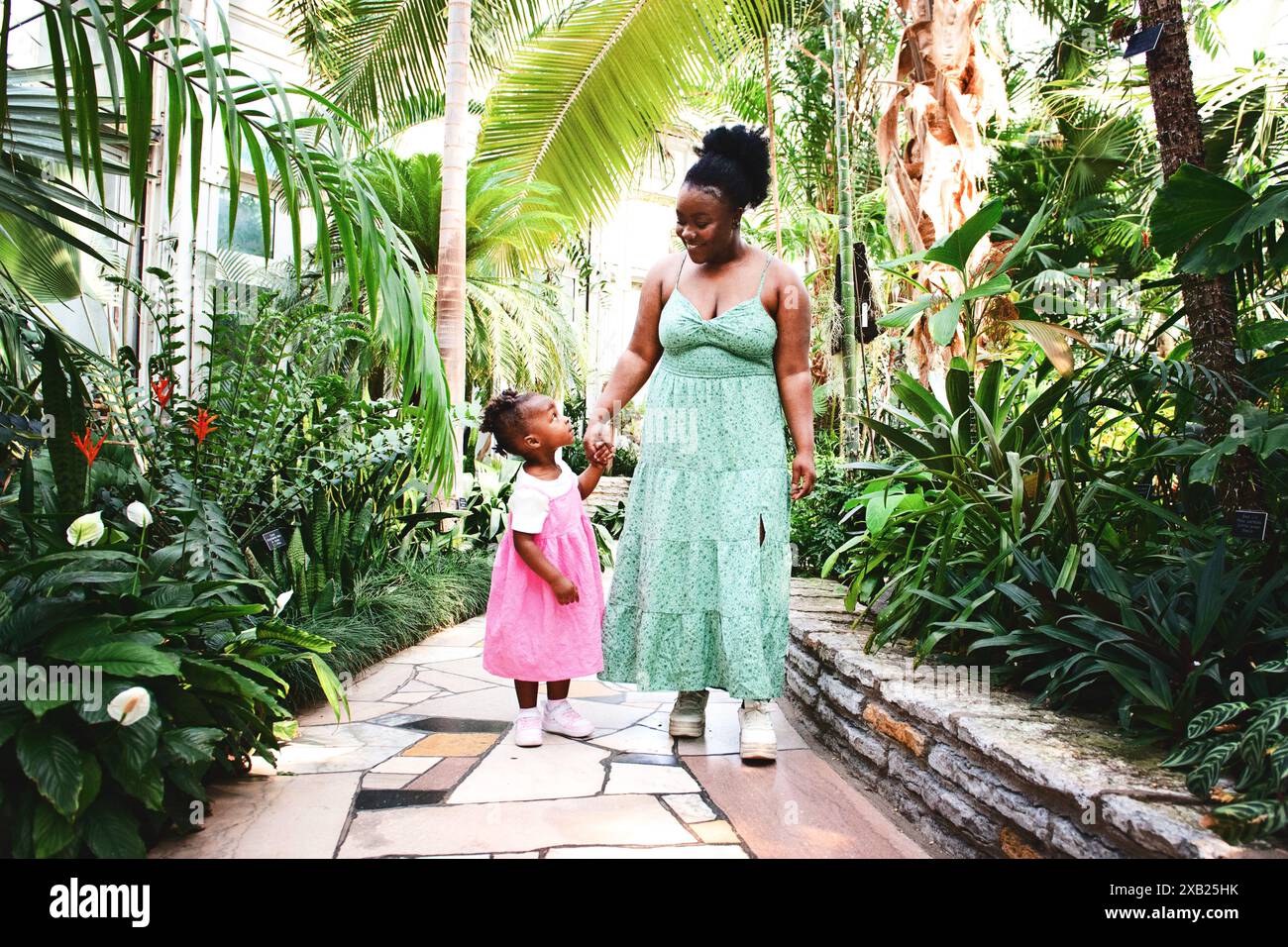 Mother walking with toddler daughter on lovely path Stock Photo - Alamy