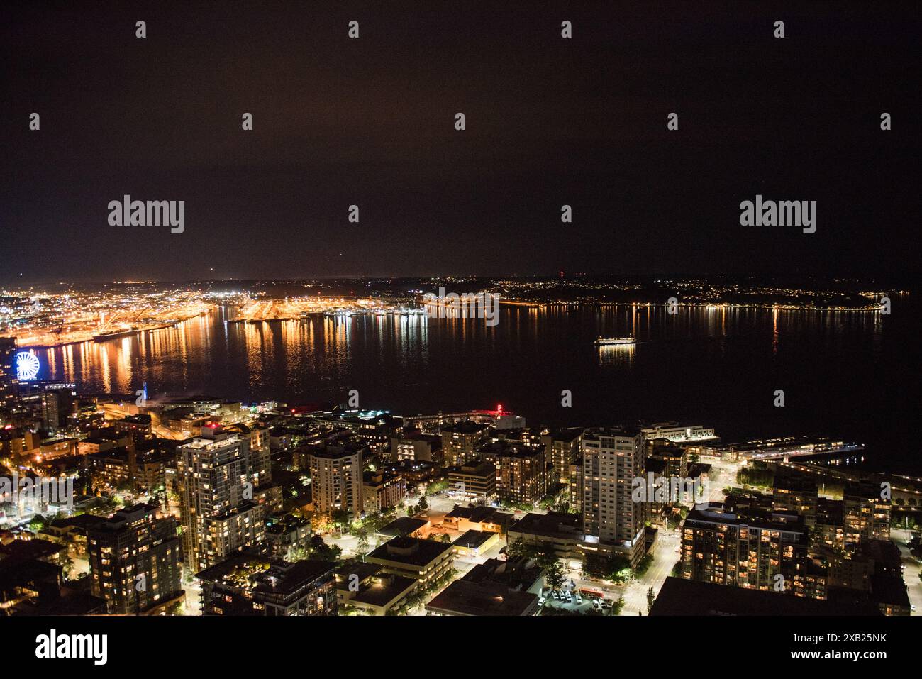 Bright lights shining at night over seattle washington Stock Photo - Alamy