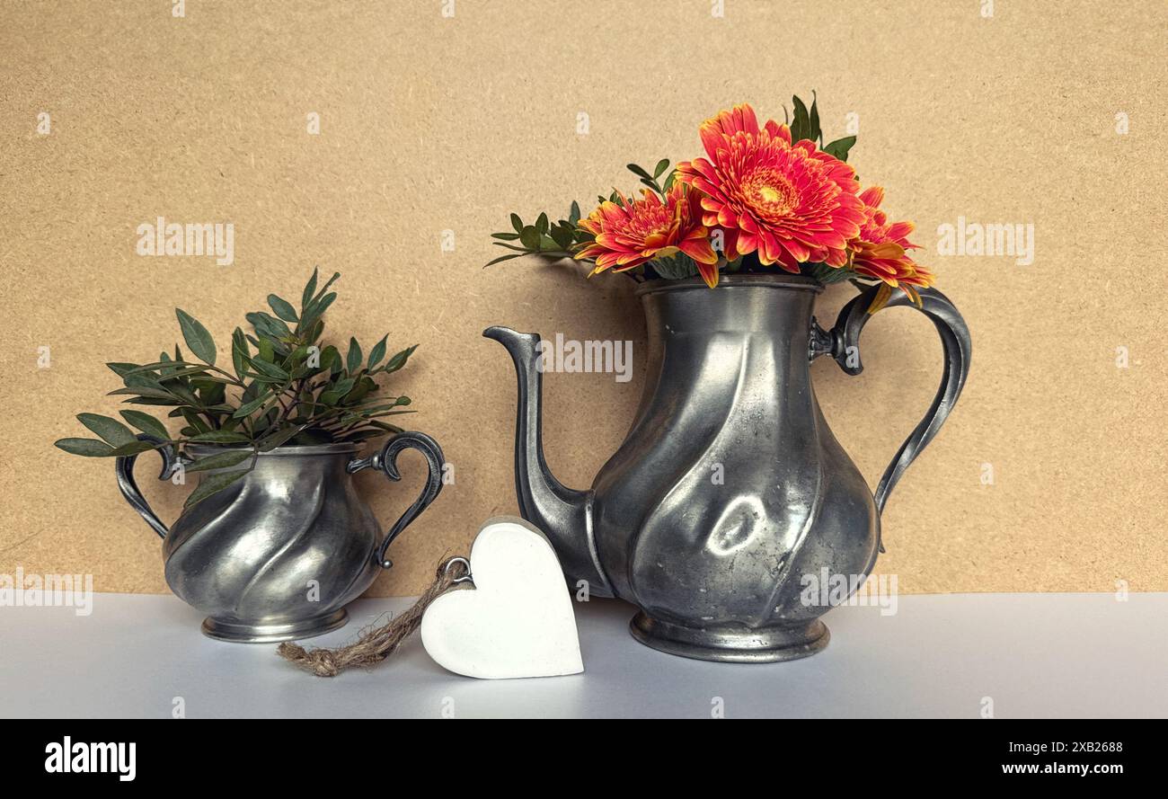 Vintage Teapot and Pitcher with Flowers and Heart Decor Stock Photo - Alamy