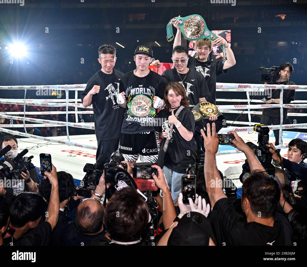 Japan's Naoya Inoue, second left, poses with his brother Takuma Inoue ...