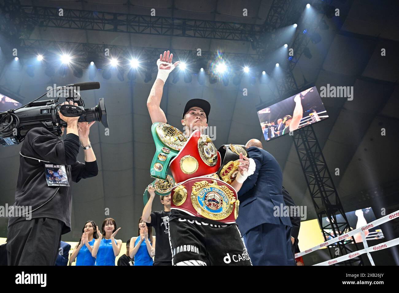 Japan's Naoya Inoue celebrates with his championship belts after ...