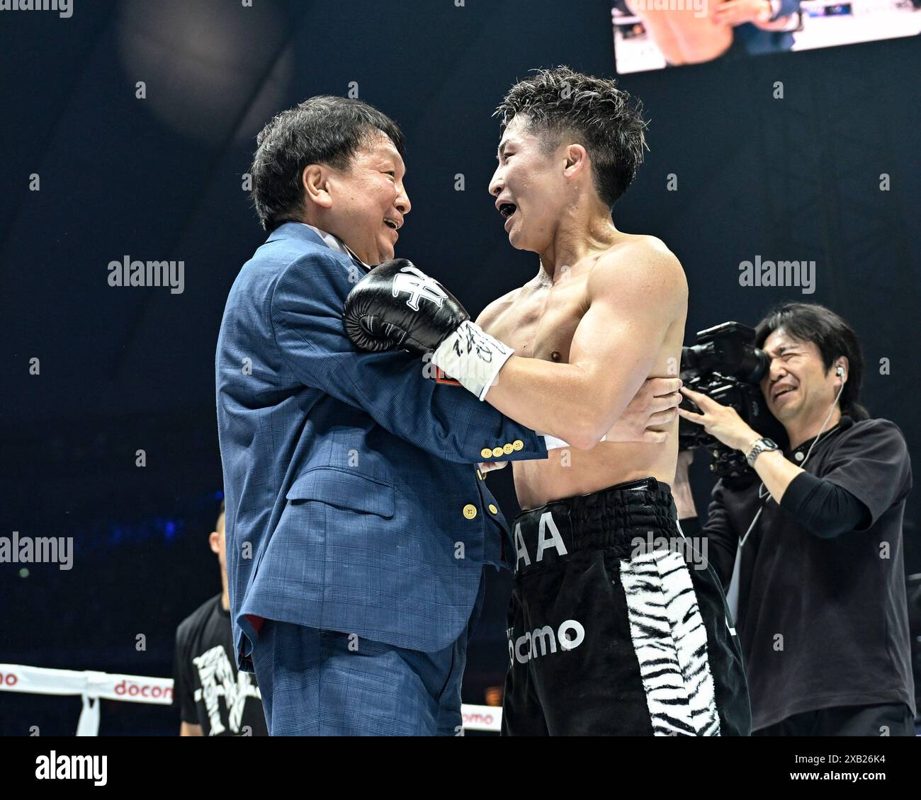 Japan's Naoya Inoue, right, celebrates his sixth round TKO victory with ...