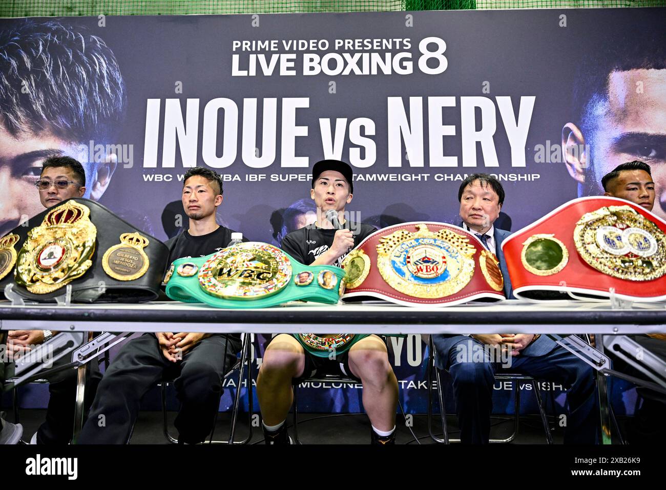 Japan's Naoya Inoue, center, attends a press conference after winning the IBF-WBA-WBC-WBO ...