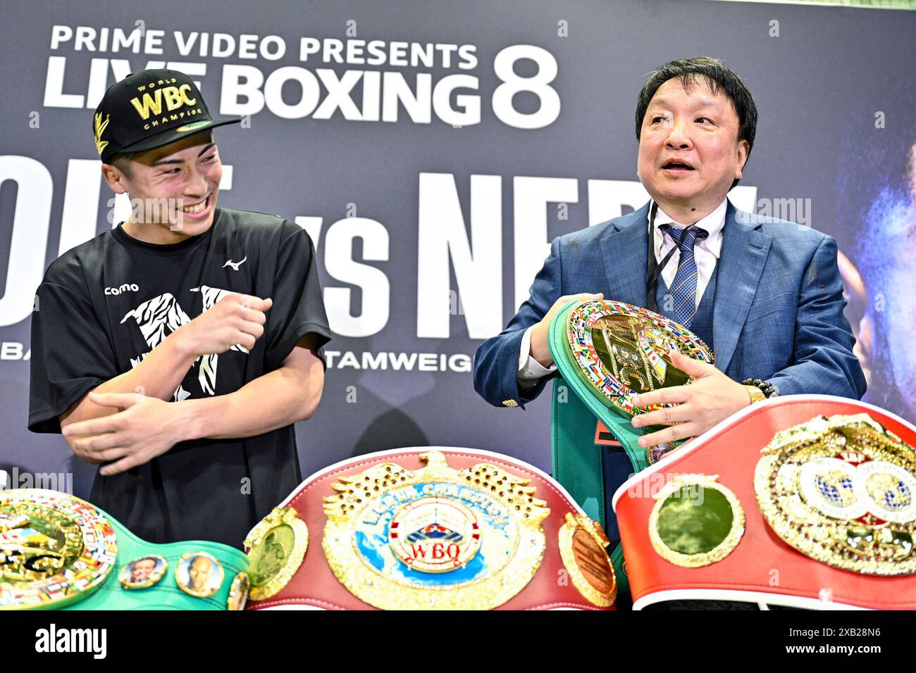 Japan's Naoya Inoue, left, gives his WBC Diamond Championship belt to Ohhashi Boxing Gym ...