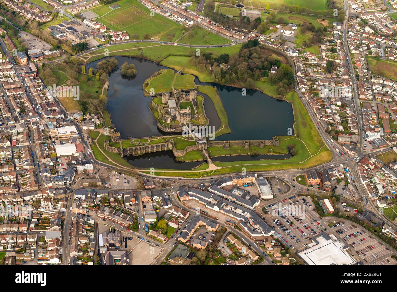 Aerial photography over South Wales. Caerphilly town centre and Castle ...