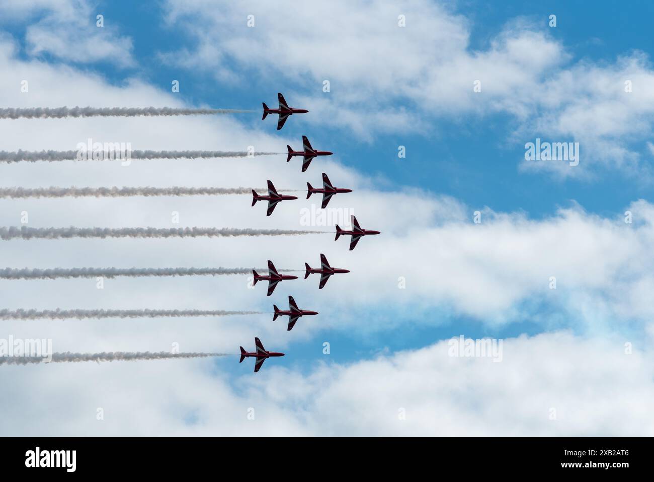 Royal air force Red Arrows team against a cloudy sky over Portsmouth ...