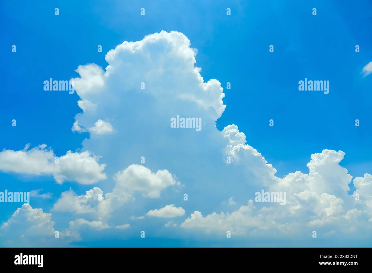 The development growth of powerful cumulus clouds in the summer sky in ...