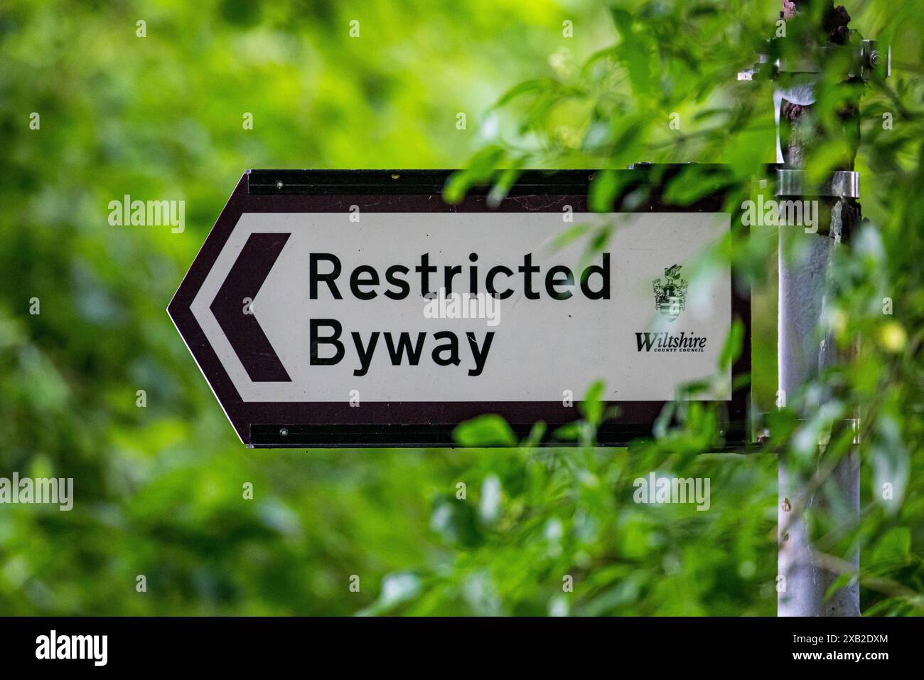 Directional Restricted Byway signage on a rusty metal post in the ...