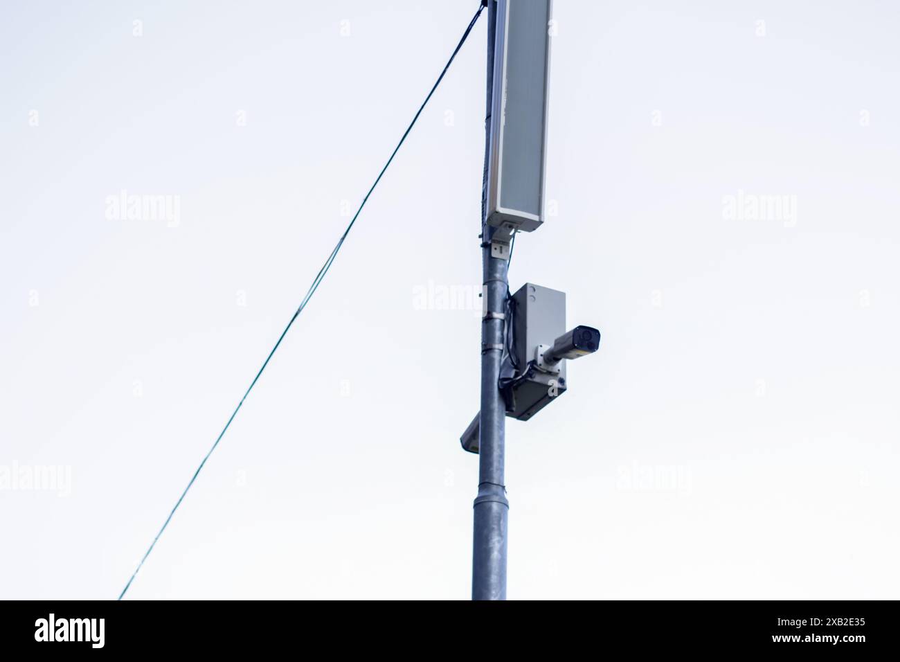 CCTV tool on grey sky background. CCTV camera monitoring a park for ...