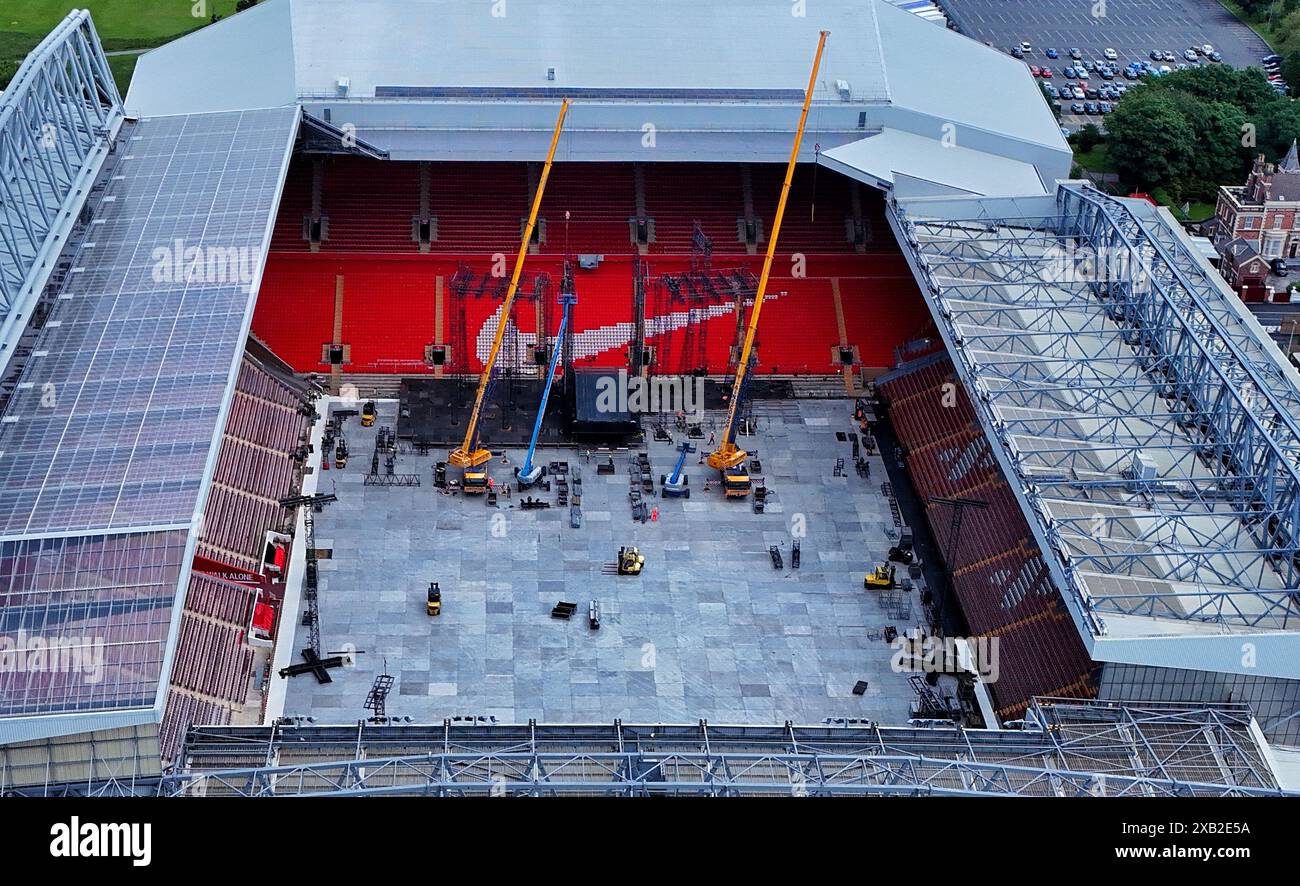 A stage being constructed on the pitch of Anfield Stadium in Liverpool ...