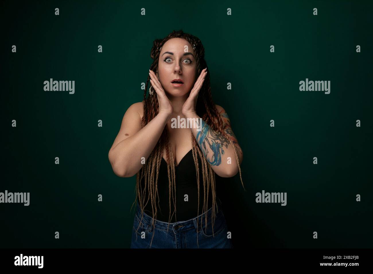 Woman With Dreadlocks Covering Her Face Stock Photo - Alamy