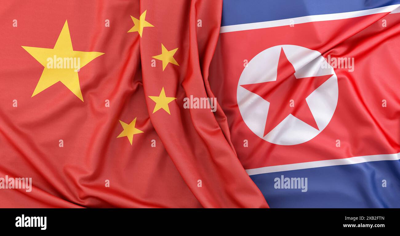 Two flags lying side by side, representing the complex relationship ...