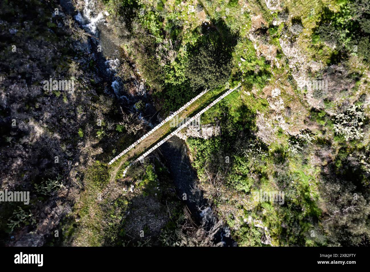 Medieval narrow stone bridge crossing river. Akapnou village, Limassol ...