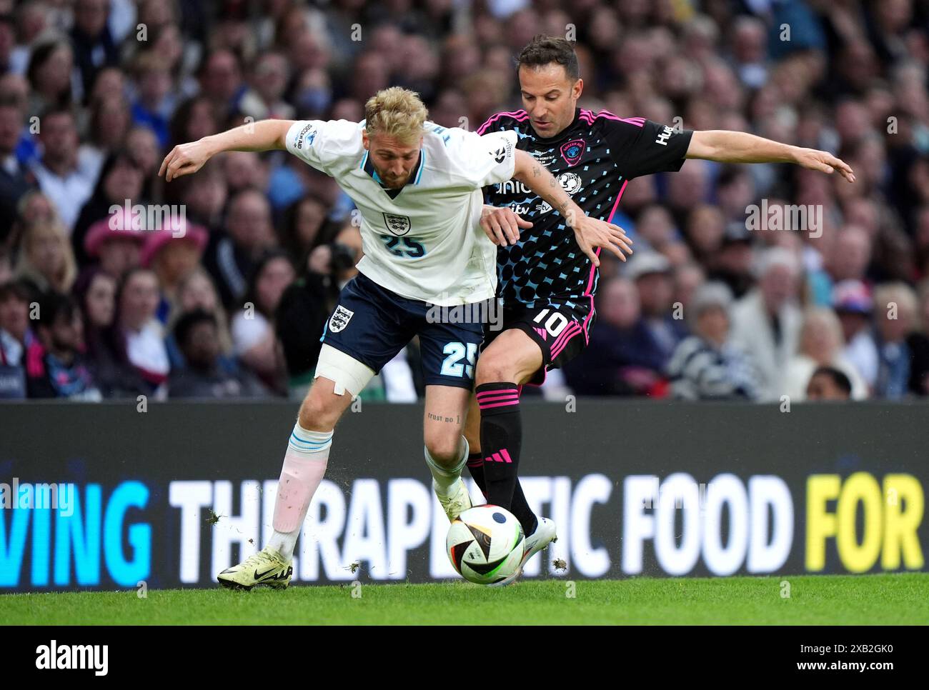 England's Sam Thompson (left) and World XI's Alessandro Del Piero ...
