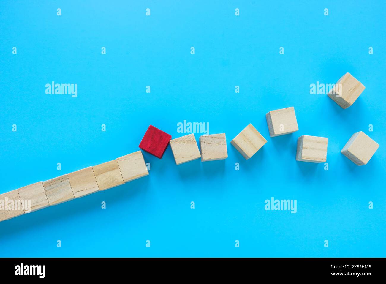 The red cube as an unexpected problem or obstacle breaks the line Stock ...