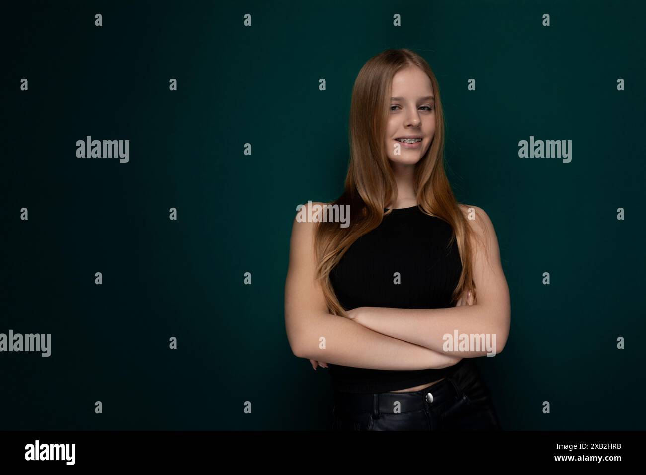 Woman Crossing Arms for Picture Stock Photo - Alamy