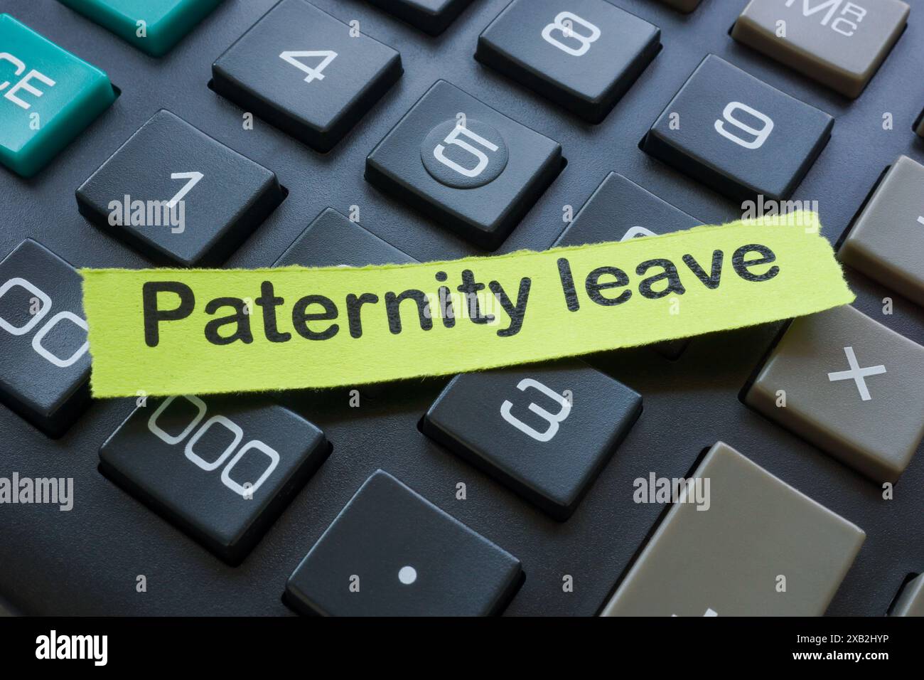 Paternity leave. Close-up of a piece of paper and a calculator Stock ...