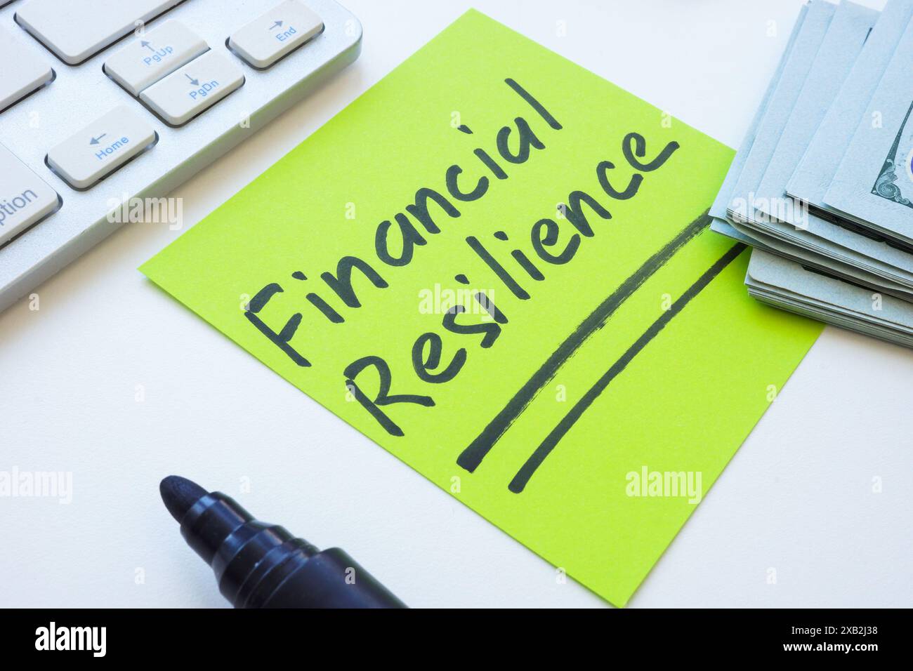 Financial resilience inscription, cash and marker Stock Photo - Alamy