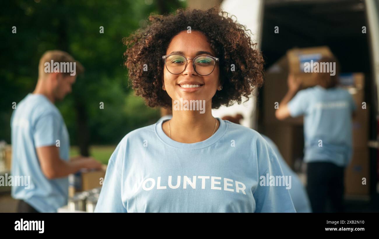 Portrait of a Happy Helpful Black Female Volunteer. Young Adult ...