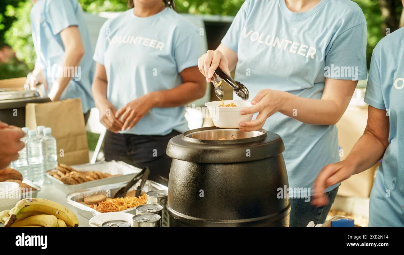 Humanitarian Organization: Close Up of Volunteers Preparing Free Meals ...