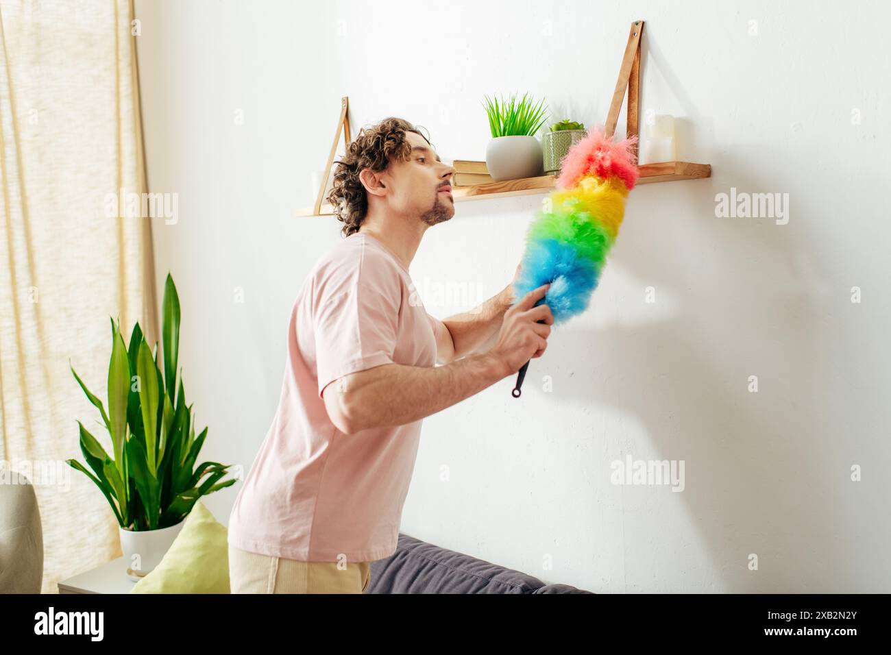 Care duster hi-res stock photography and images - Alamy