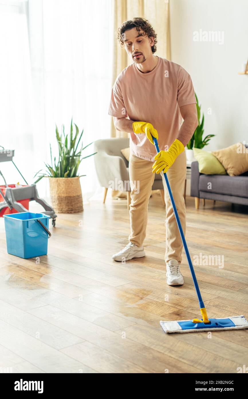 Man mopping floor hi-res stock photography and images - Alamy