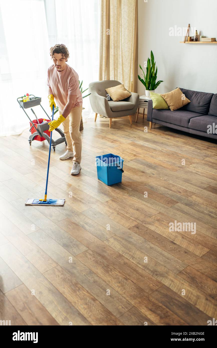 Man mopping floor hi-res stock photography and images - Alamy