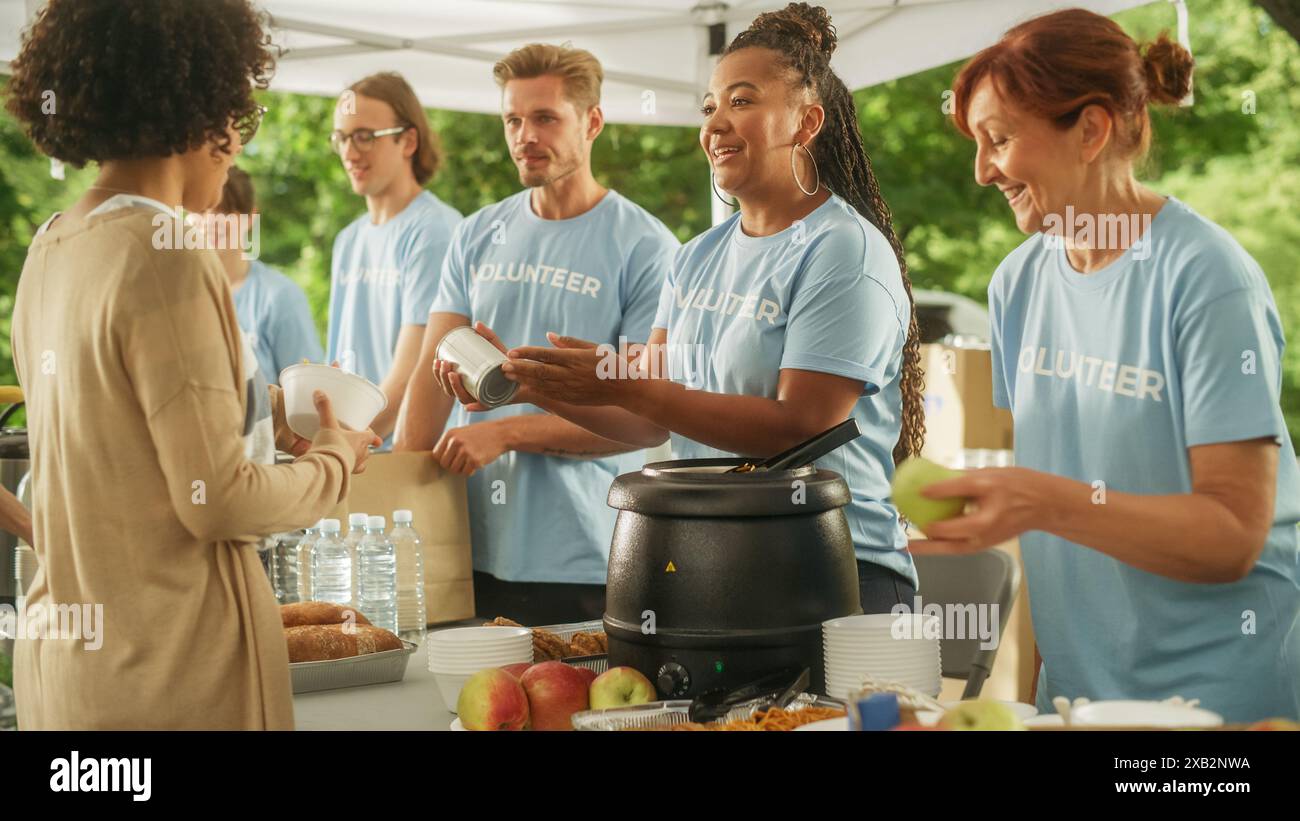 Humanitarian Aid Concept: Volunteers Preparing Free Food and Feeding ...