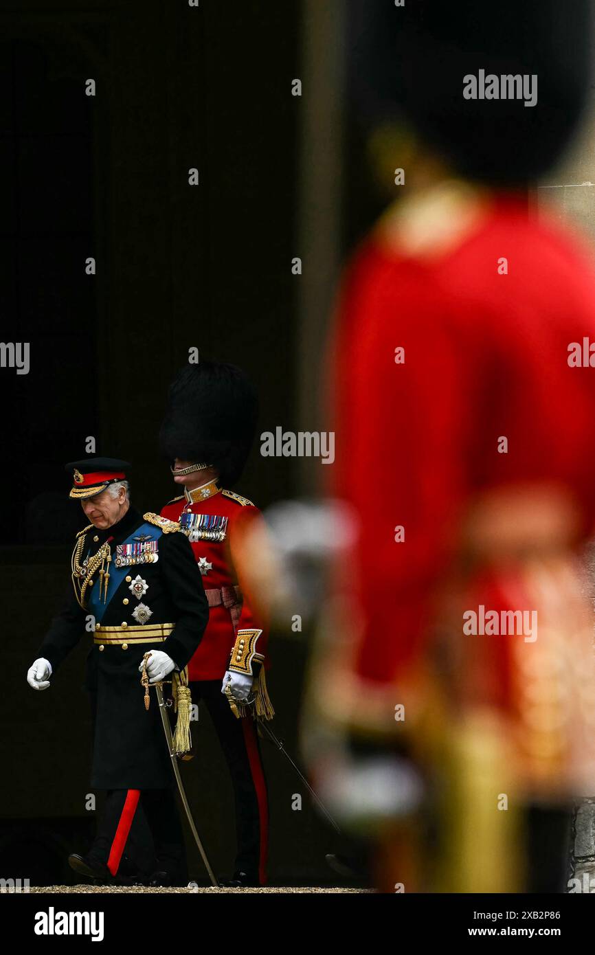 King Charles III, Colonel-in-Chief of the Household Division, presents ...