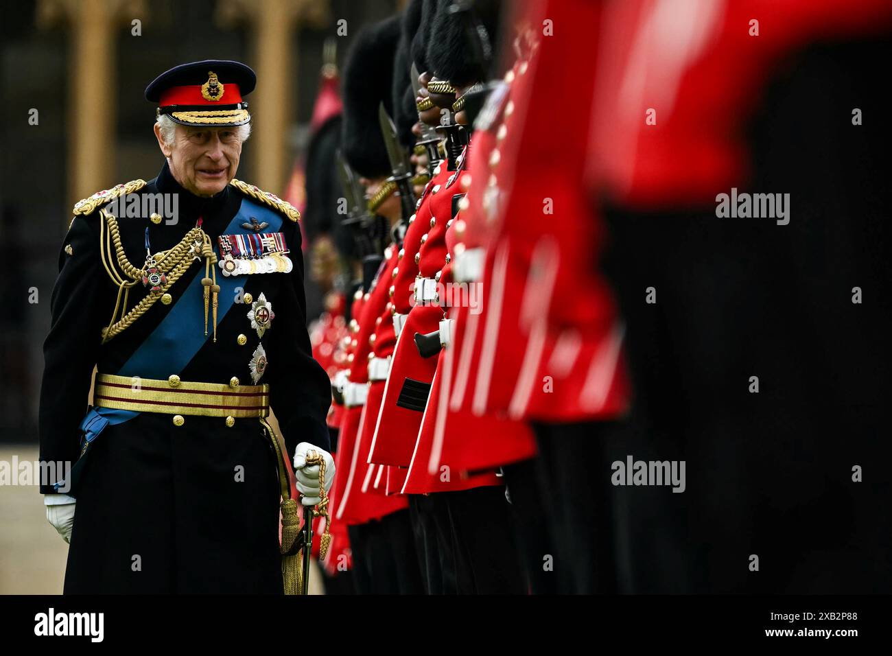 King Charles III, Colonel-in-Chief of the Household Division, presents ...