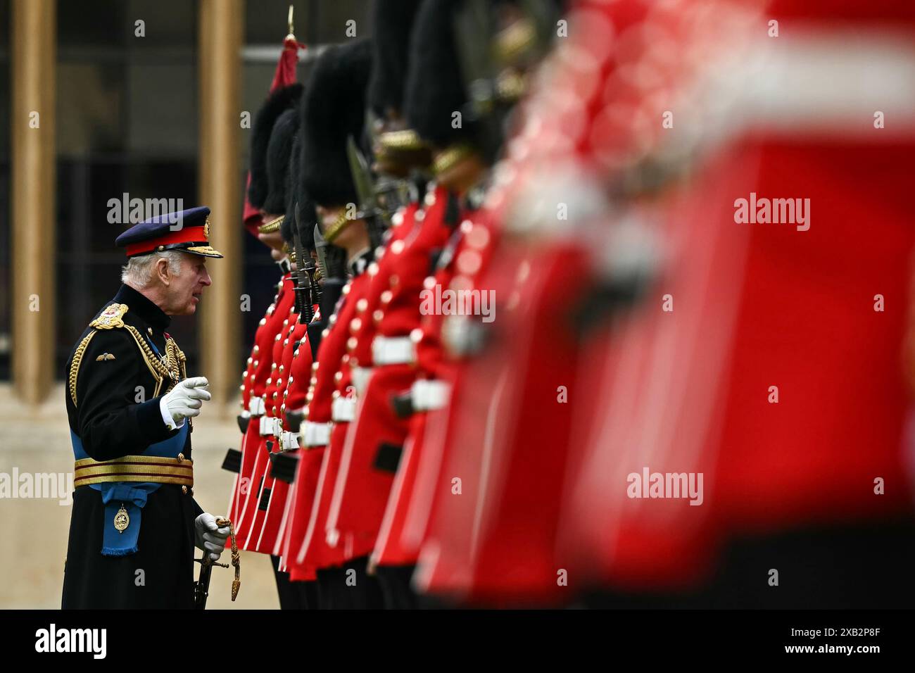 King Charles III, Colonel-in-Chief of the Household Division, presents ...