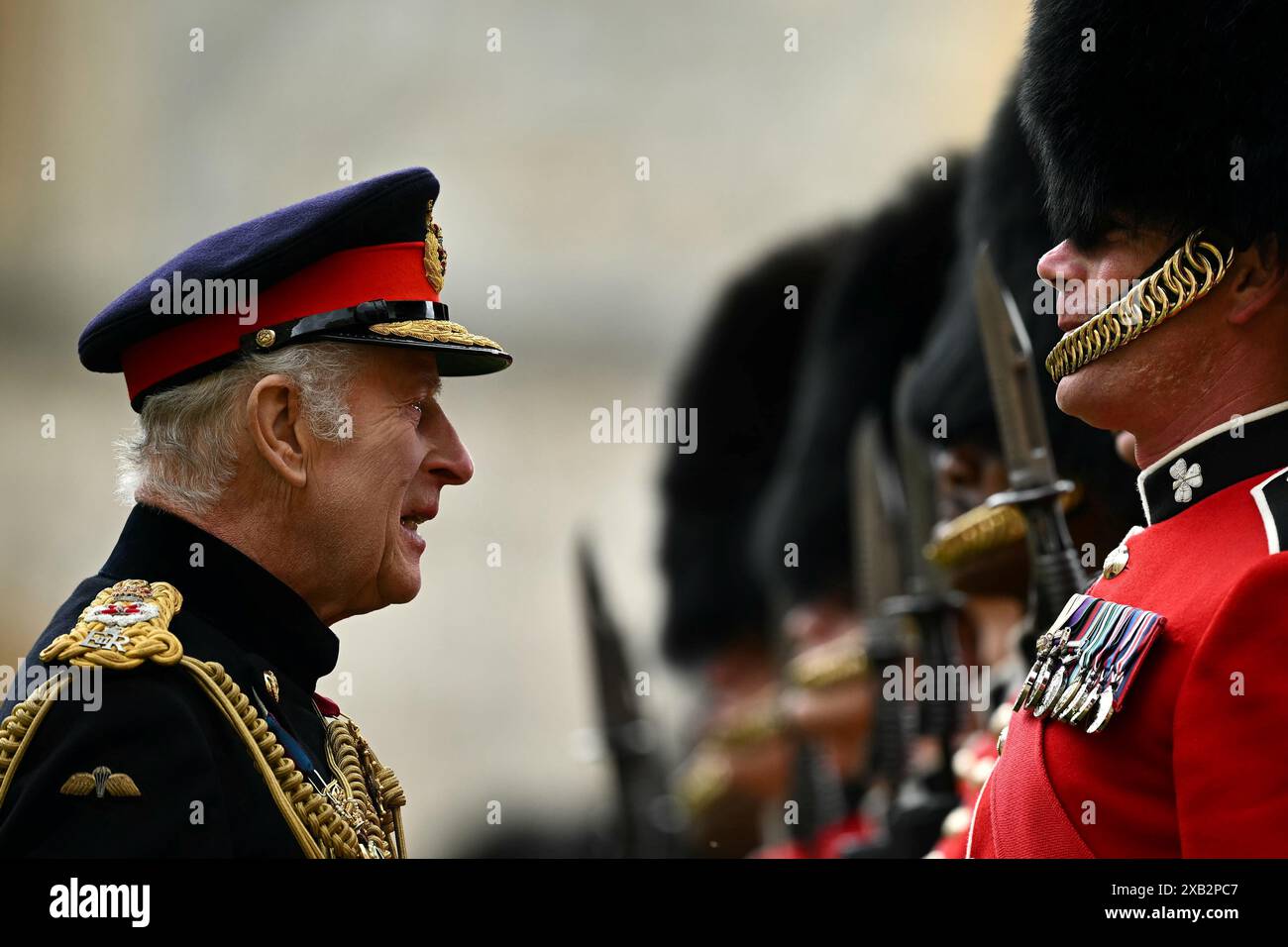 King Charles III, Colonel-in-Chief of the Household Division, presents ...