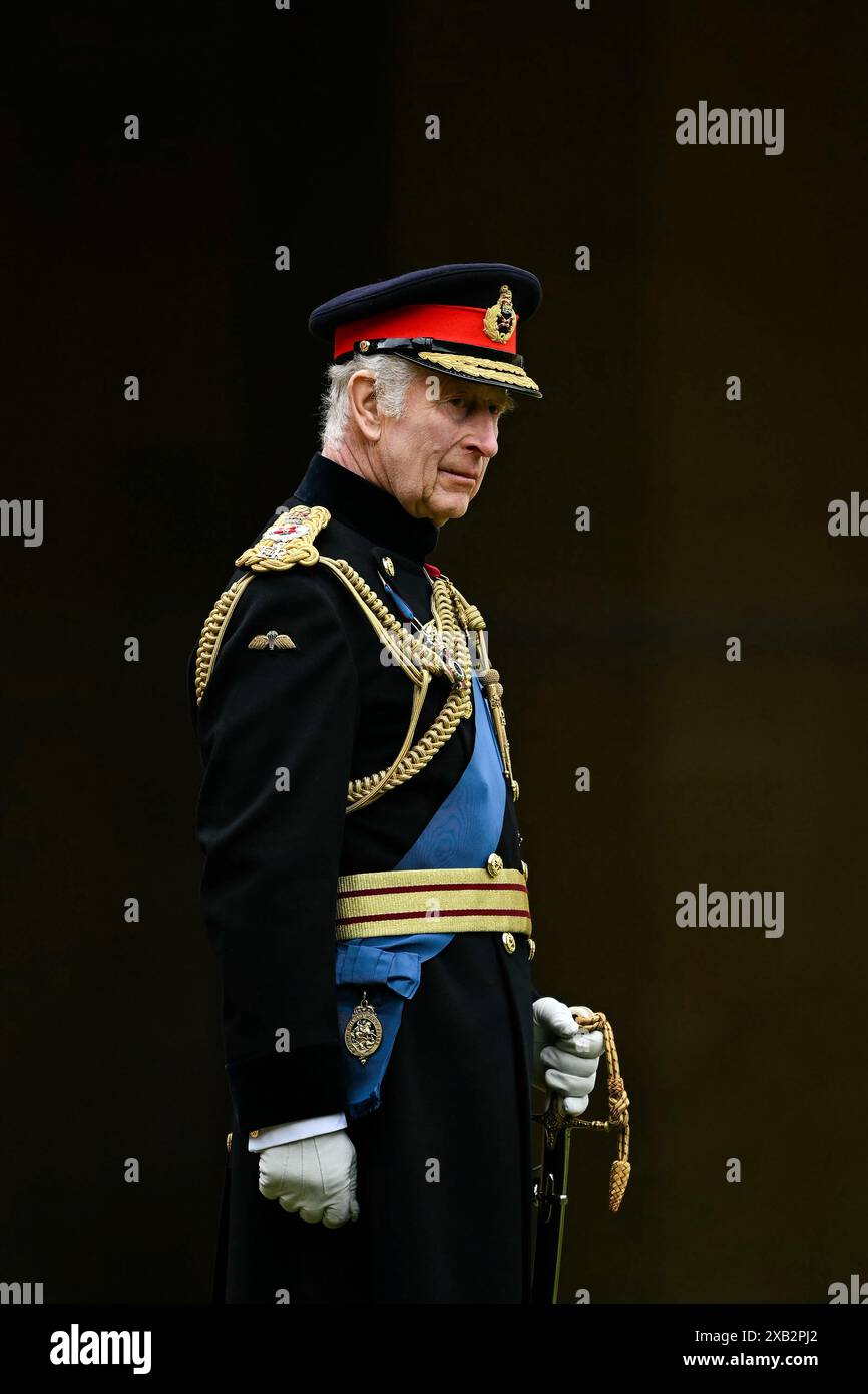 King Charles III, Colonel-in-Chief of the Household Division, presents ...
