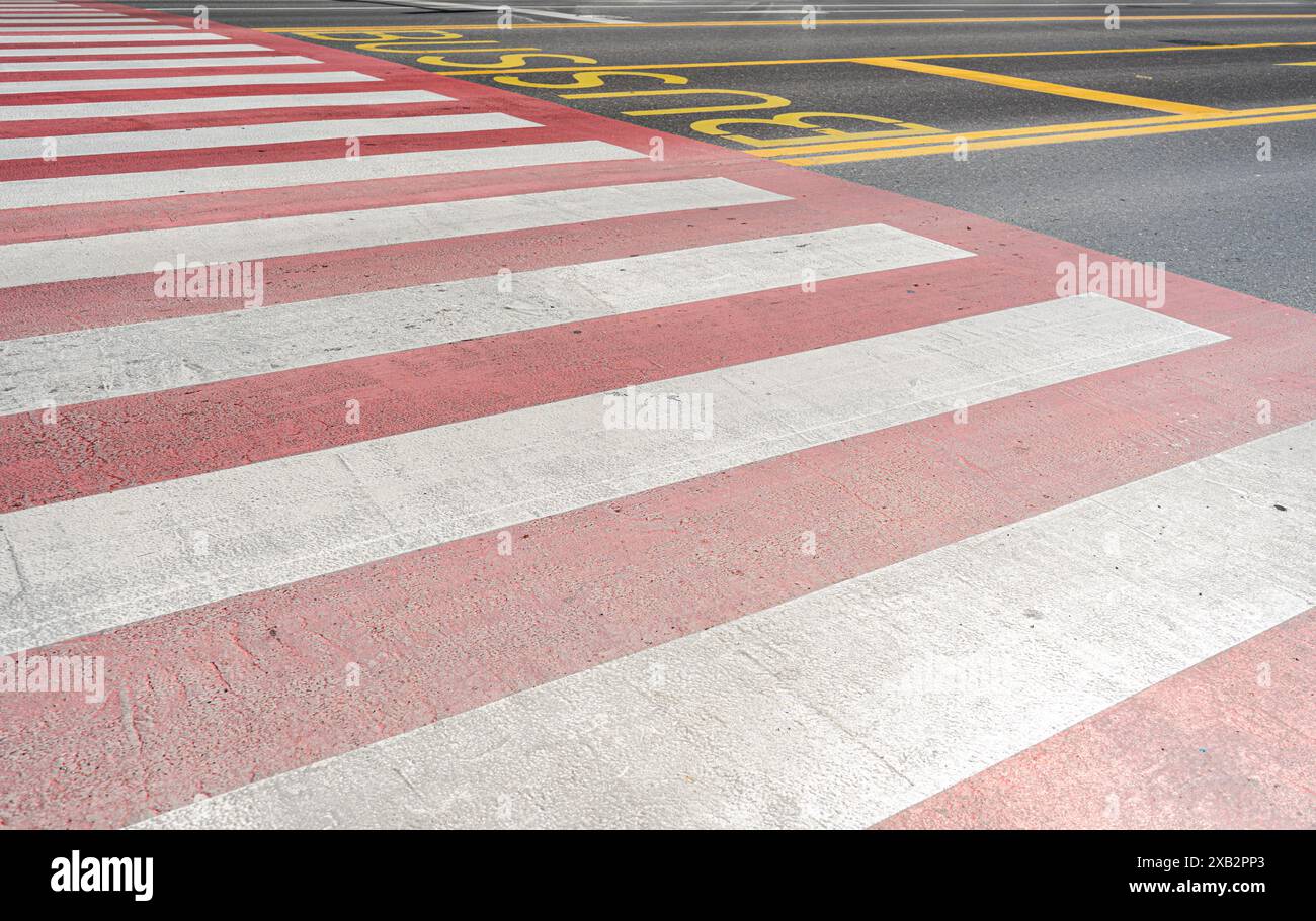 A lively color palette on a zebra crossing in Tbilisi, featuring red ...